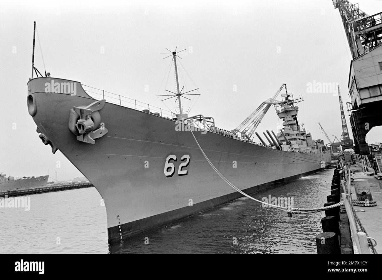 Port bow view of the dock battleship NEW JERSEY (BB-62). Last minute ...