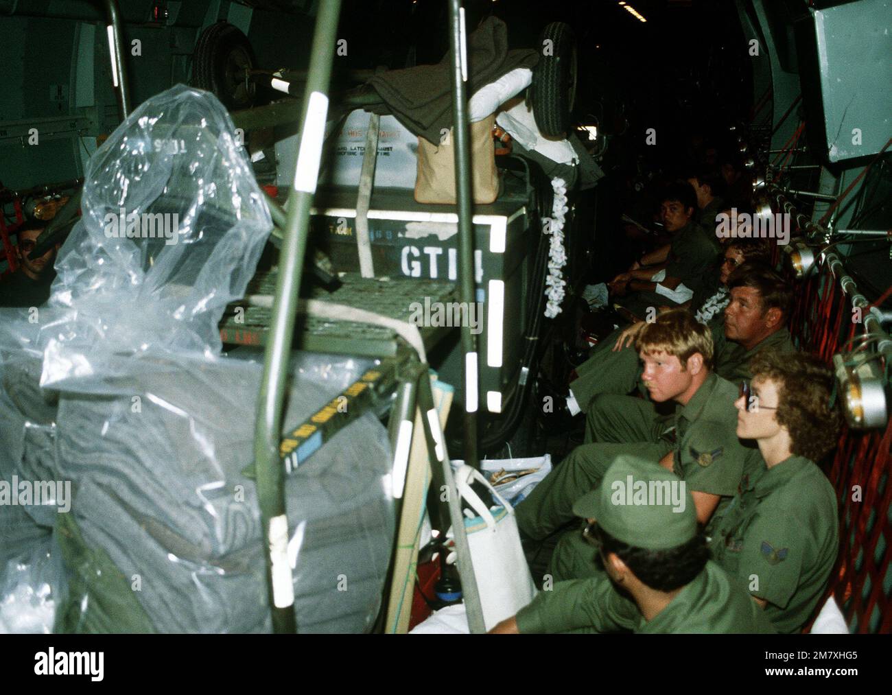 Air Force personnel and equipment aboard a C-141 Starlifter aircraft ...