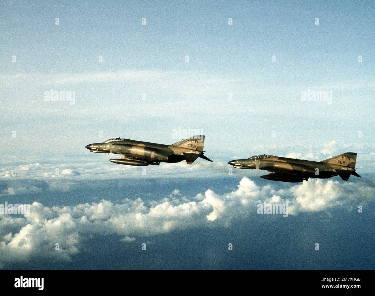 An air-to-air left side view of two F-4 Phantom II aircraft of the 3rd ...