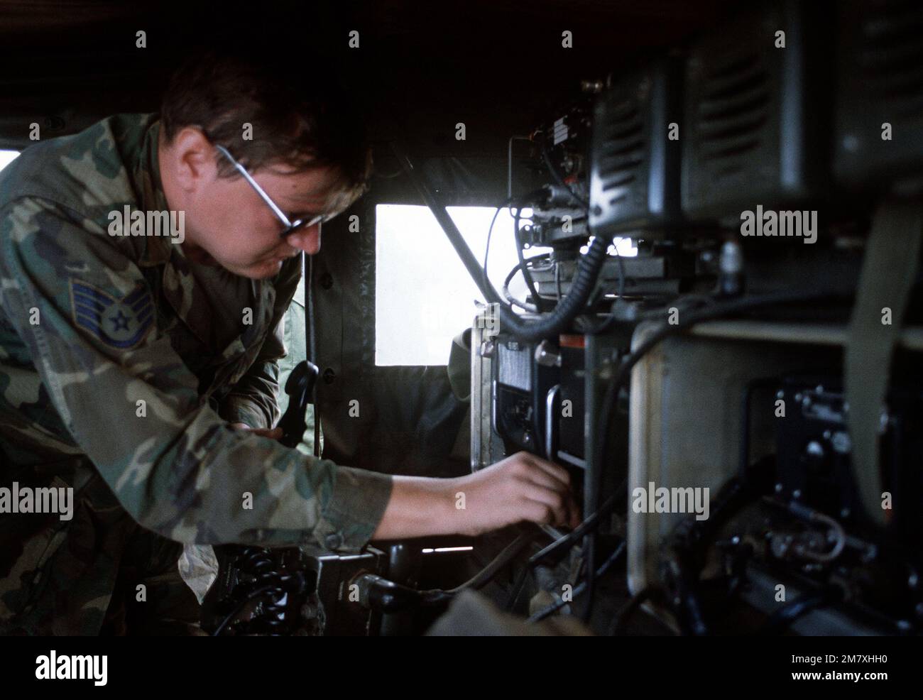 A forward air controller operates a radio used to direct an F-4 Phantom ...