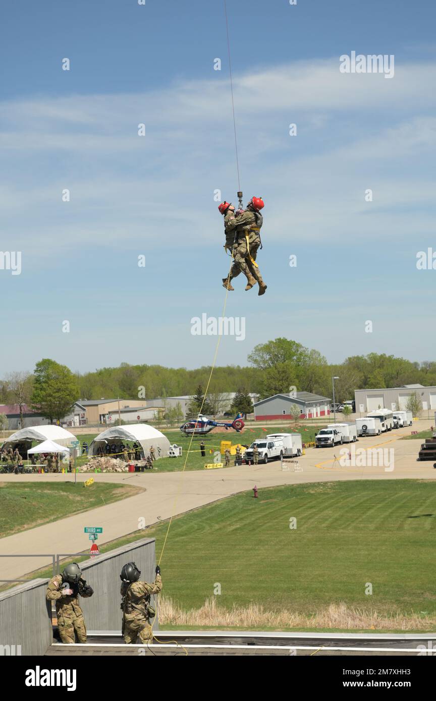 Wisconsin National Guardsmen are hoisted by the 104th Aviation Unit out ...