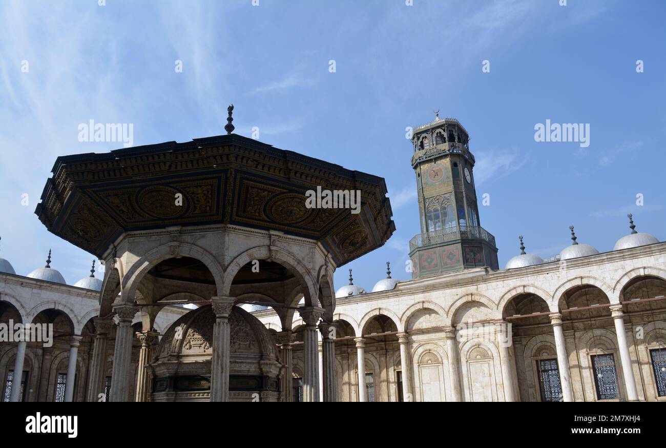 Ablution fountain and the clock tower in courtyard of The great mosque ...