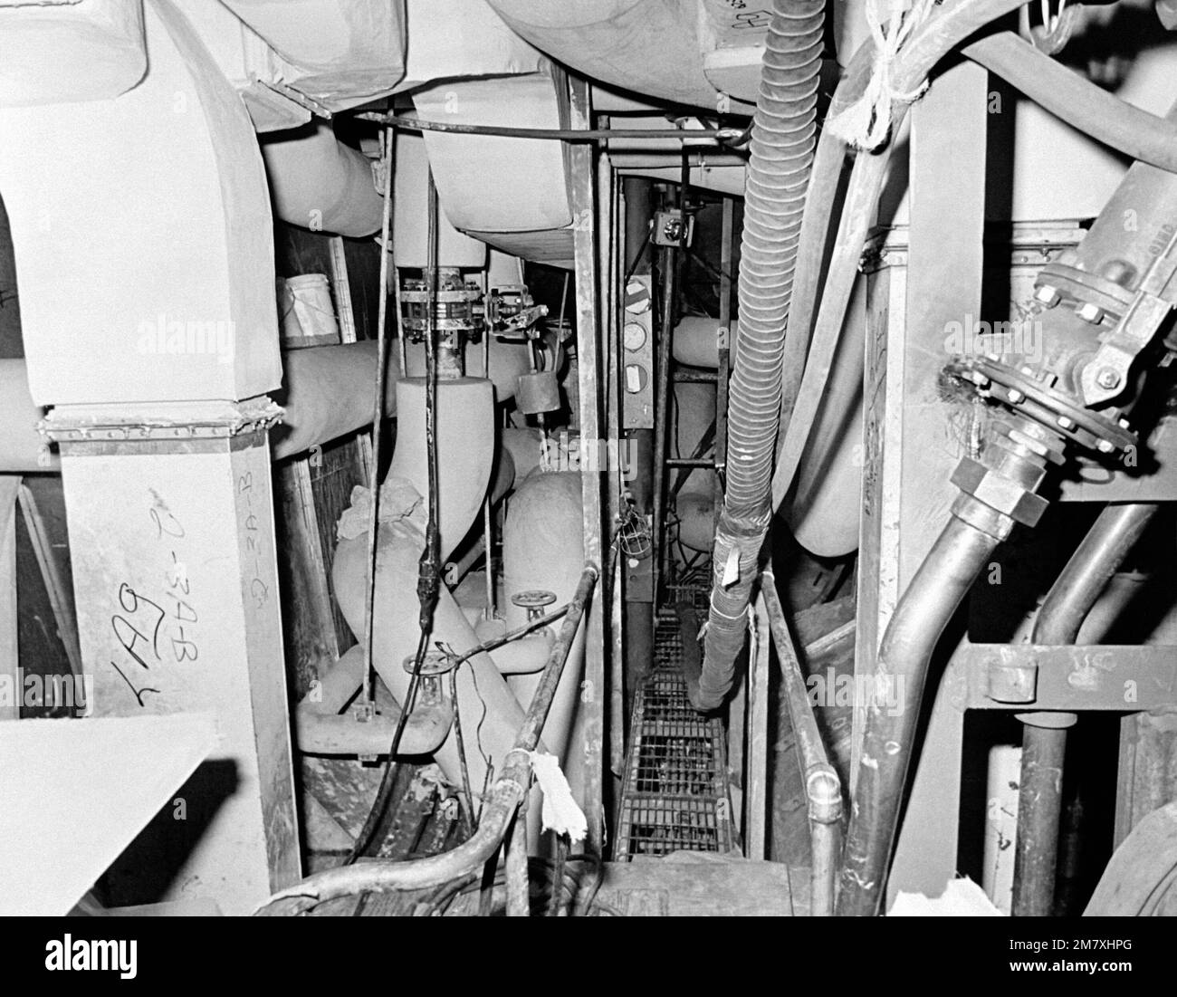 An interior view of the engine room on the guided missile frigate USS ...