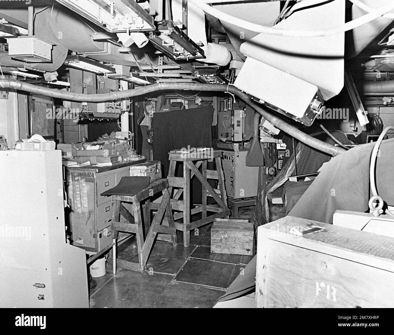 An interior view of the combat information center on the guided missile ...