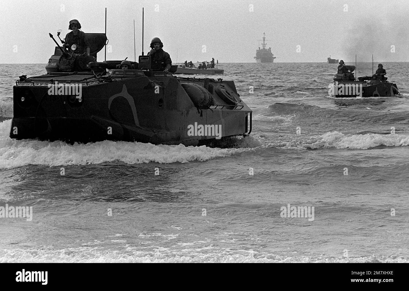 An LVTP7 tracked landing vehicle is driven ashore by Marine of the 32nd ...