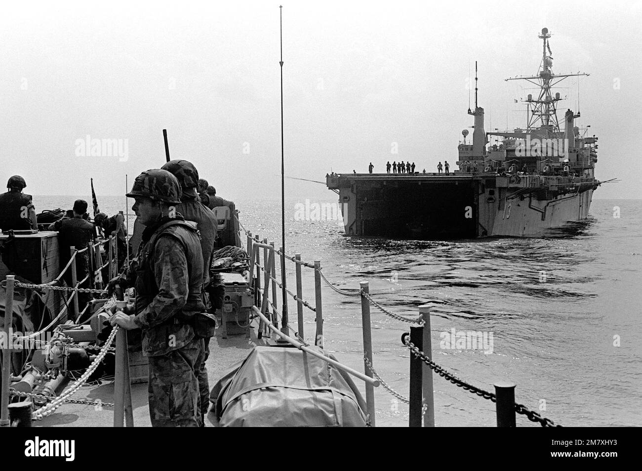 Members of the 32nd Marine Amphibious Unit, aboard a utility landing ...