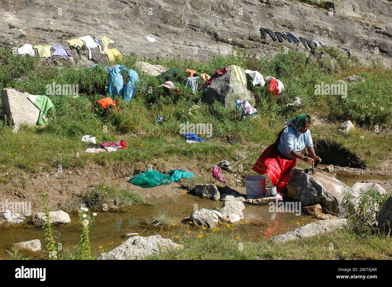 Tarahumara Indian woman washing in creek, near San Rafael, Copper ...