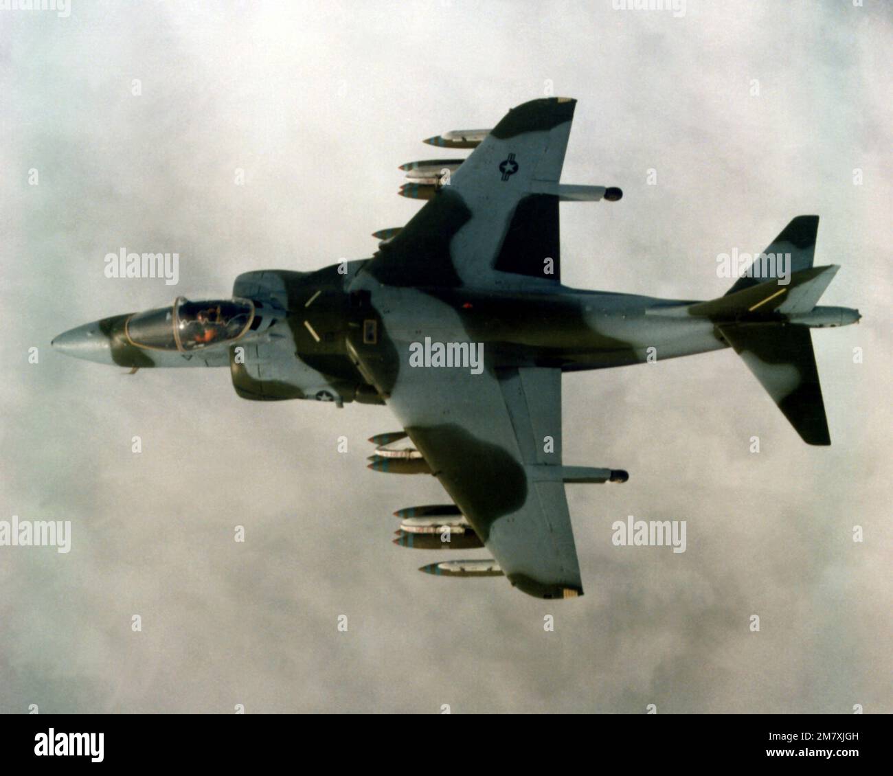 An air-to-air overhead view of a U.S. Marine Corps AV-8B Harrier II ...