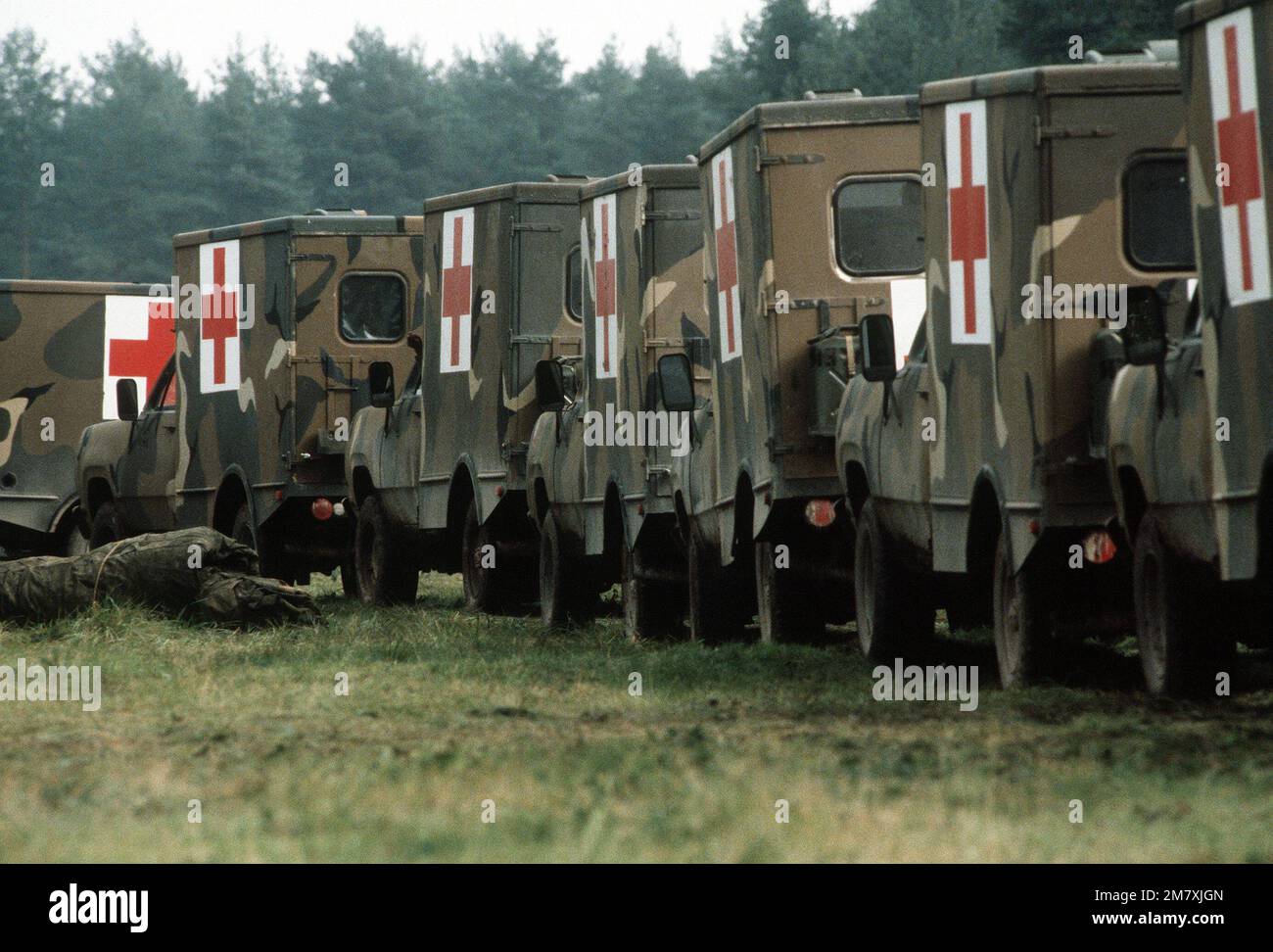 Ambulances line up a load "patients" for aeromedical evacuation during ...