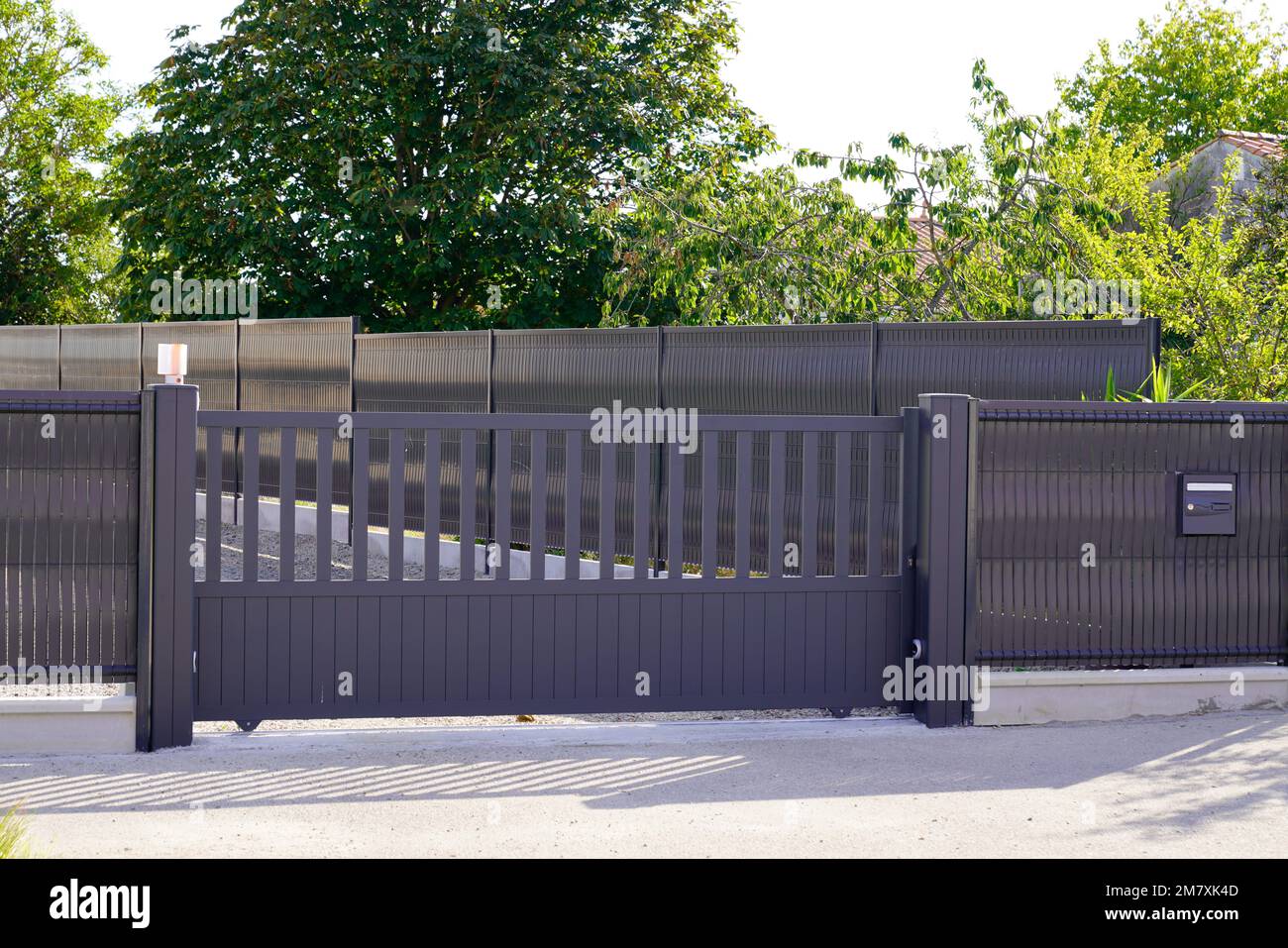 dark grey gate aluminum portal with blades suburbs house street Stock ...