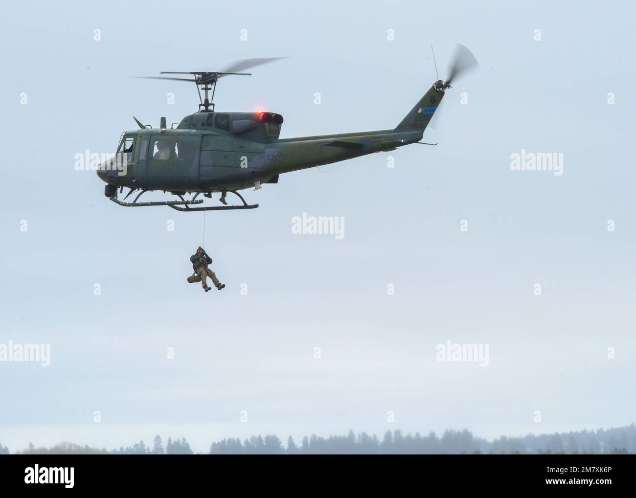 A U.S. Air Force Survival Evasion Resistance Escape Airman is hoisted ...