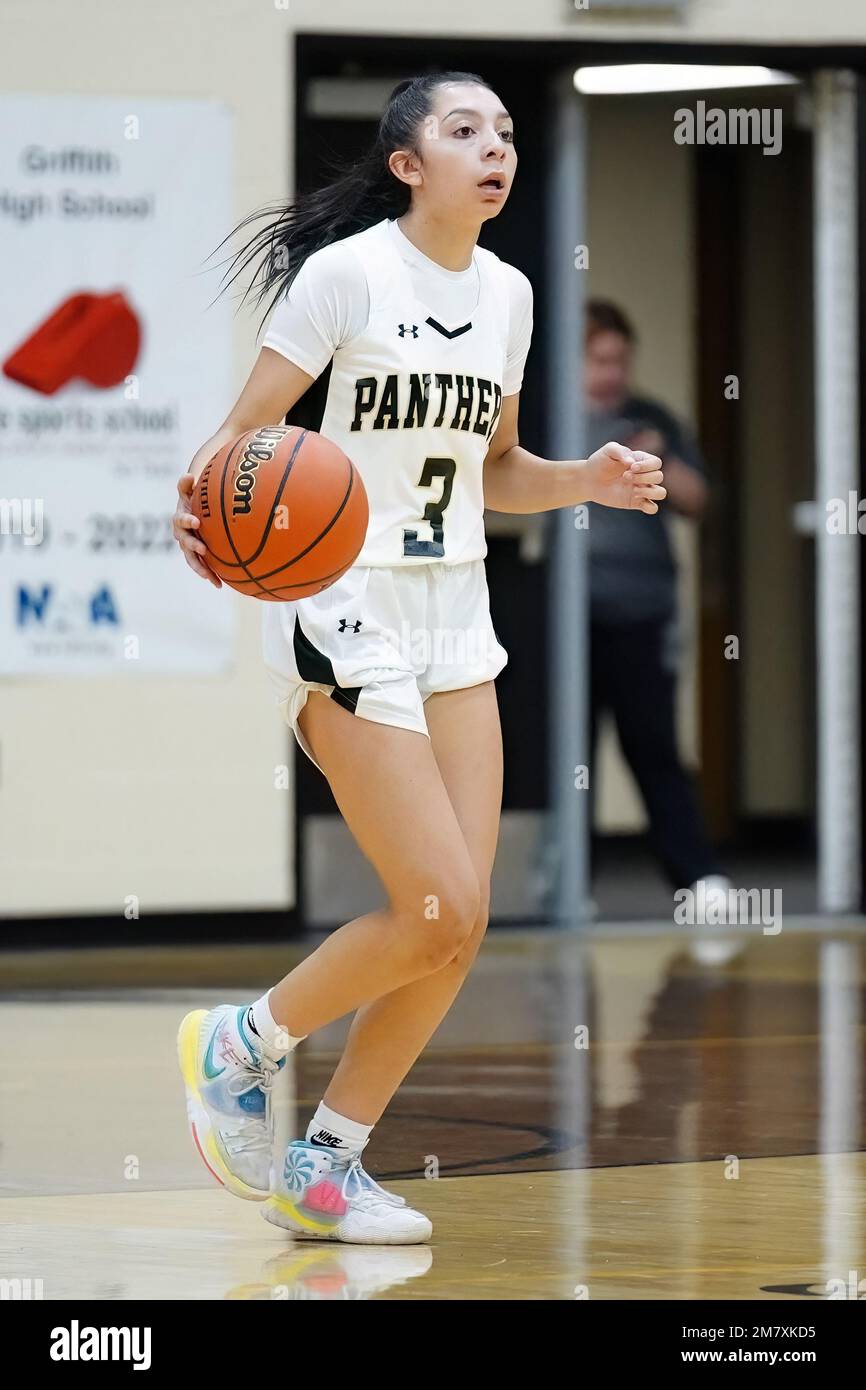A vertical shot of a young female player on a court at a girls fall ...