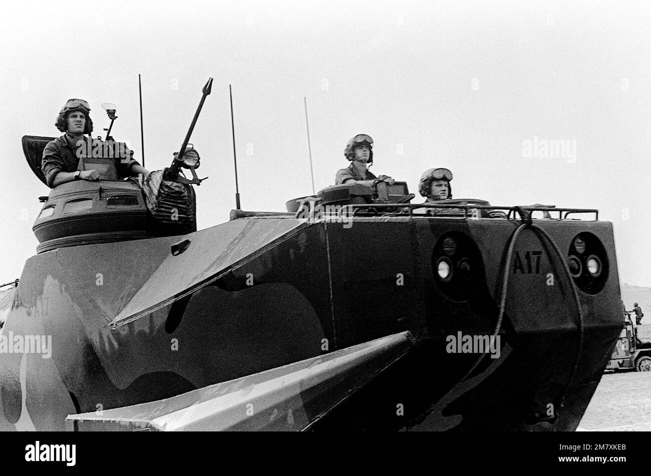 A tracked landing vehicle (LVTP7) is driven ashore by Marines of the ...