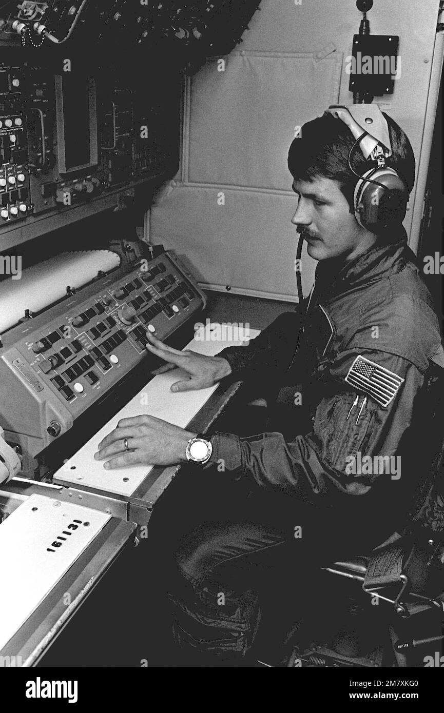 PETTY Officer 2nd Class Joe Furrow operates an acoustic sensor device ...