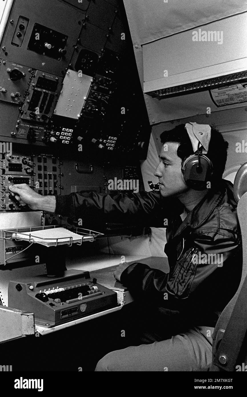 A crew member operates electronic tracking equipment aboard a P-3C ...