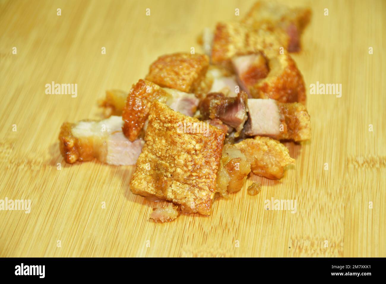 slice crispy pork on wooden chop block Stock Photo - Alamy