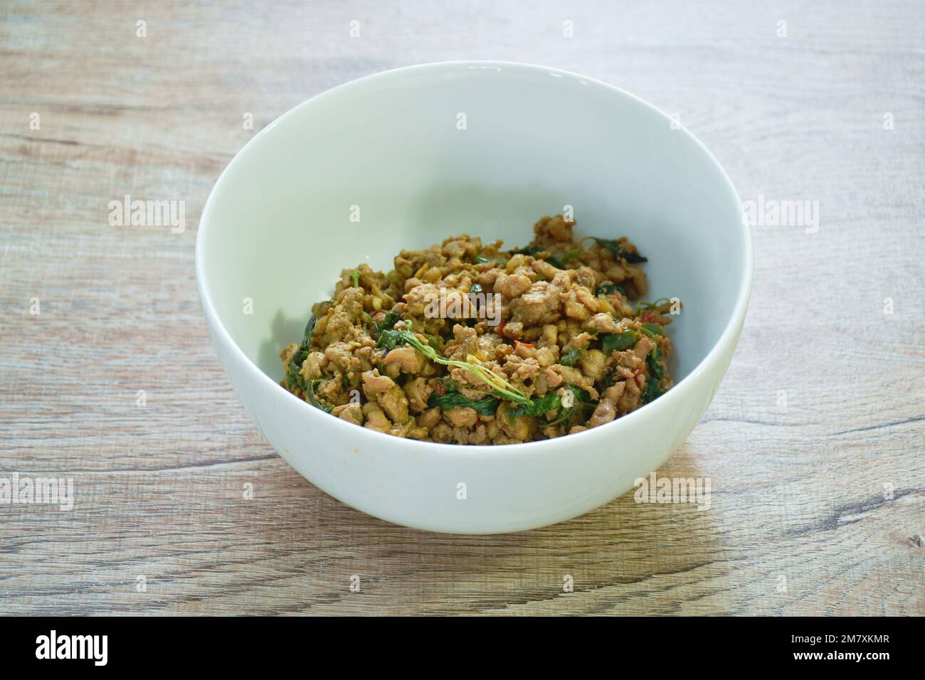 spicy stir fried chop pork with chili and basil leaf on bowl Stock ...
