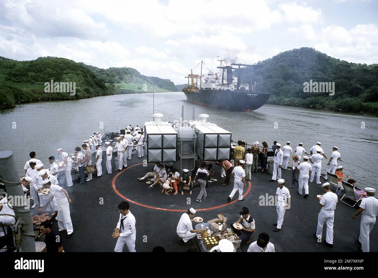 A picnic for friends and crewmen takes place on the aft deck of the ...