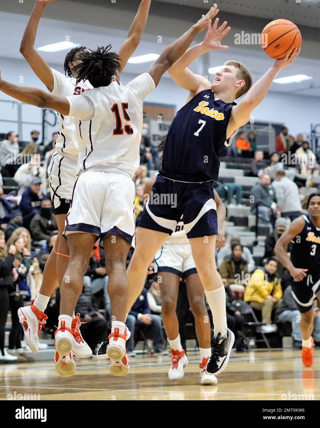 A young white basketball player shooting the ball Stock Photo - Alamy
