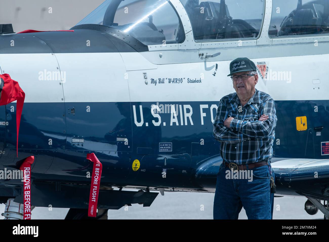 An audience member watches a 2022 Ellsworth Air and Space Show aerial ...