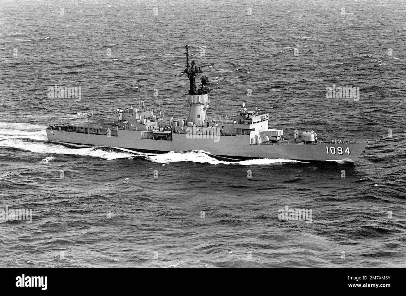 An aerial starboard beam view of the frigate USS PHARRIS (FF-1094) off ...