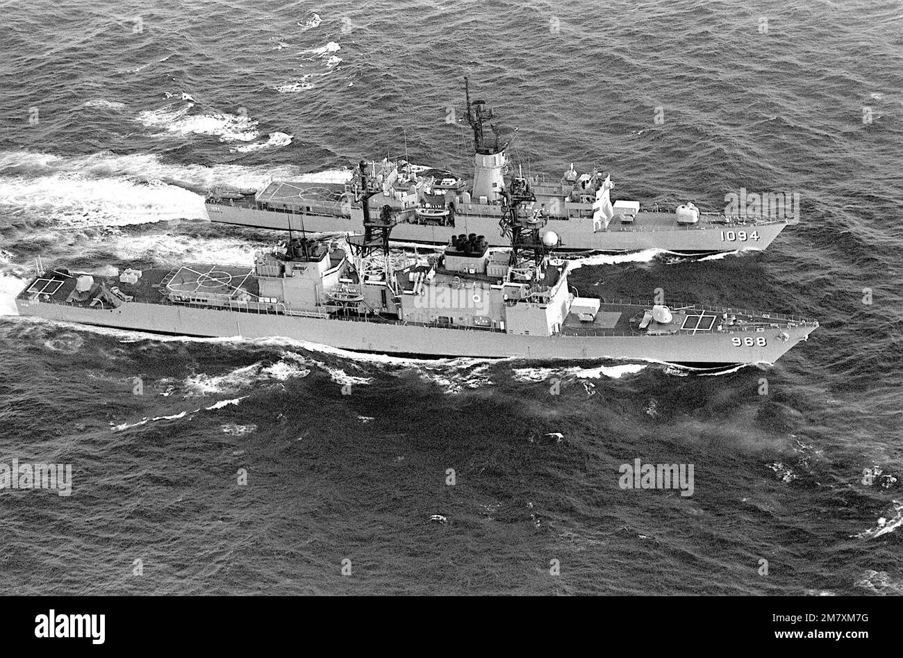 An aerial starboard beam view of the frigate USS PHARRIS (FF-1094) and ...