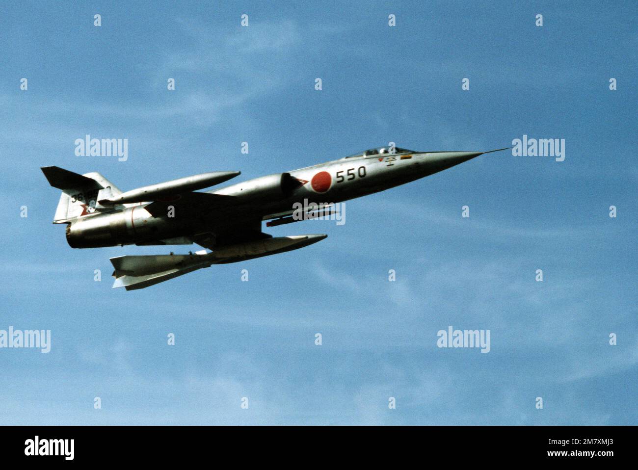A right side view of an F-104 Starfighter aircraft in flight during ...