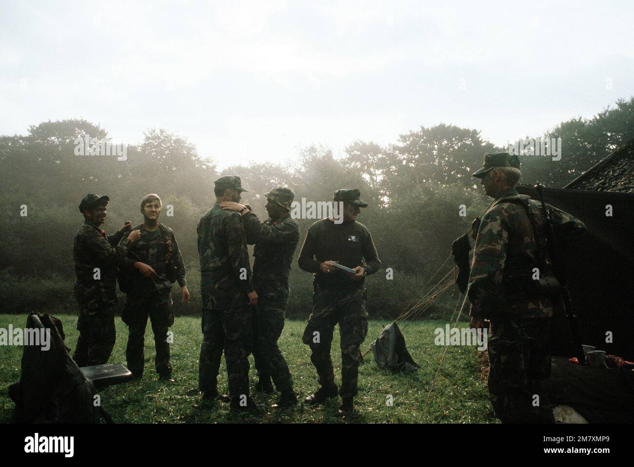 Security police camouflage themselves by putting grease paint on their ...