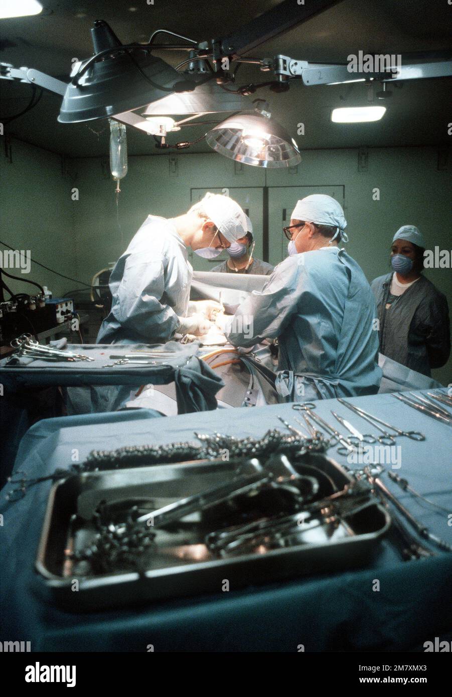 SPC 5 Troy Rice prepares a "patient" for surgery in the field operating ...