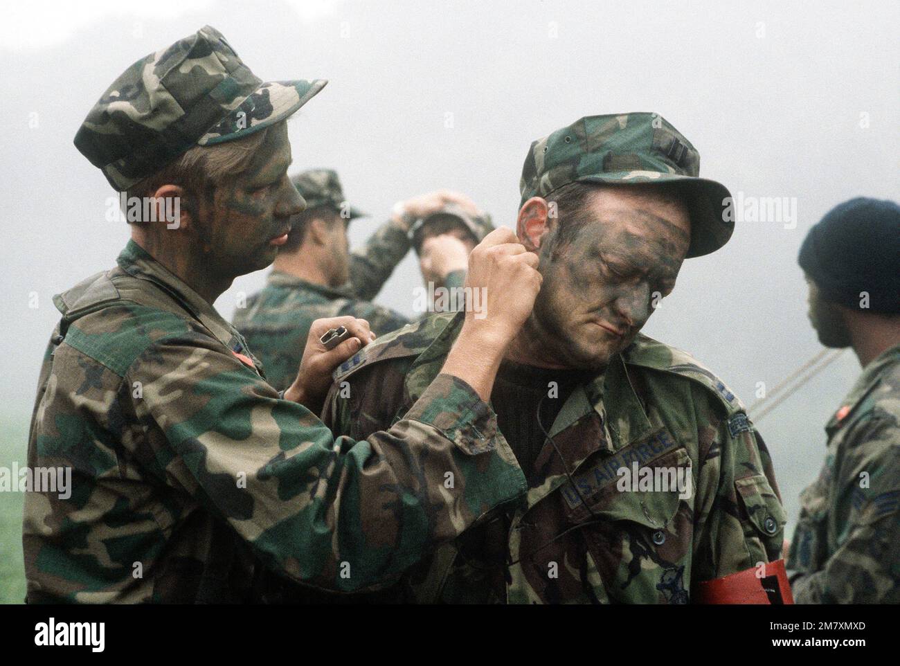 Security police camouflage themselves by putting grease paint on their ...