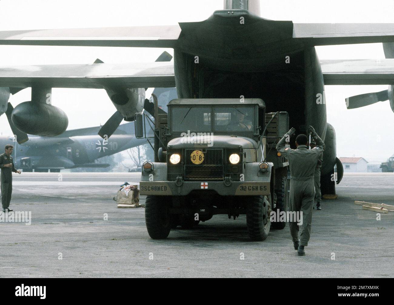 Equipment belonging to the 32nd Combat Mobility Hospital is loaded onto ...