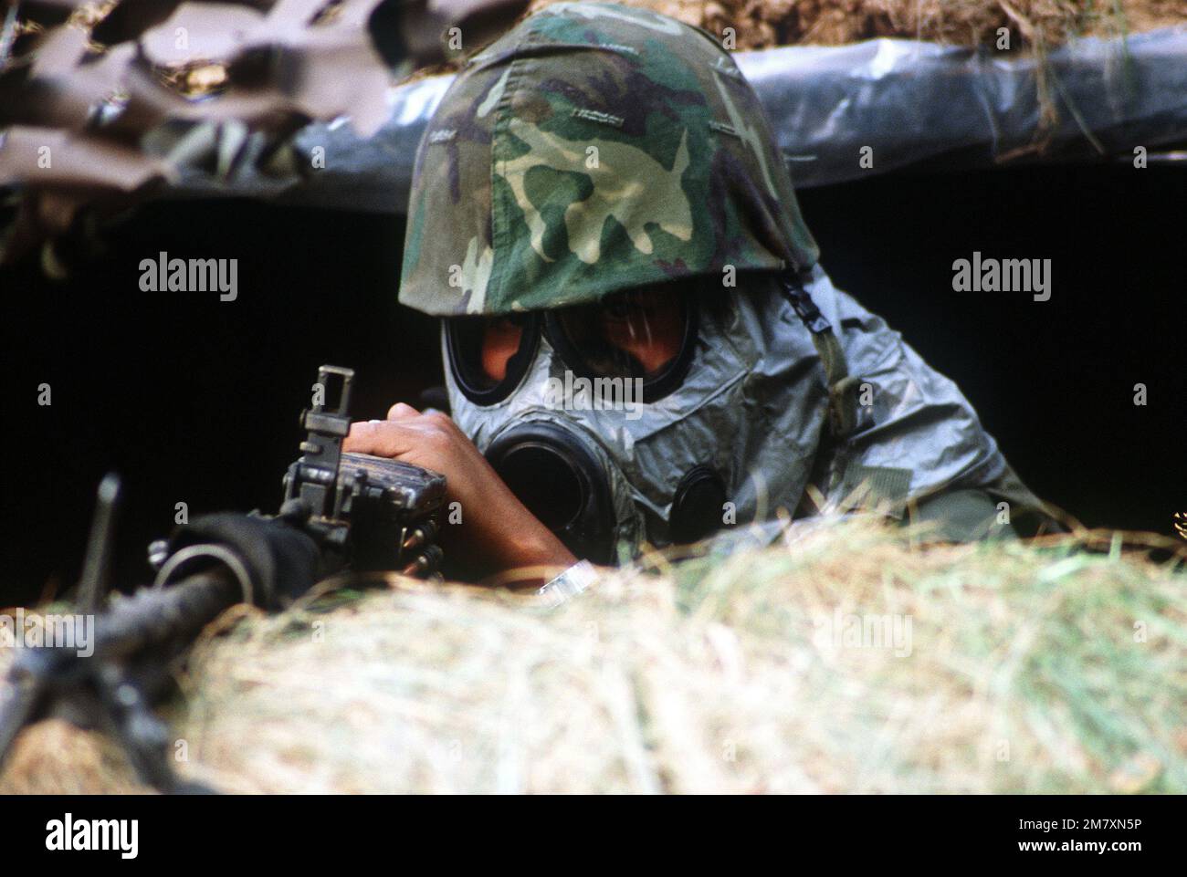 A soldier from the 4th Infantry Division wears protective head gear ...