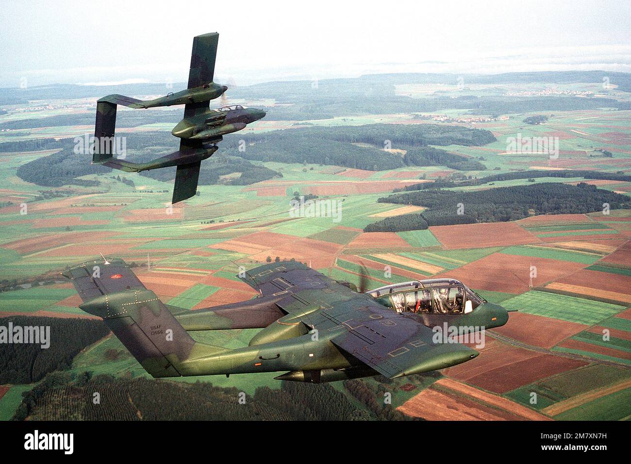 An air-to-air right side view of two OV-10 Bronco aircraft from the ...
