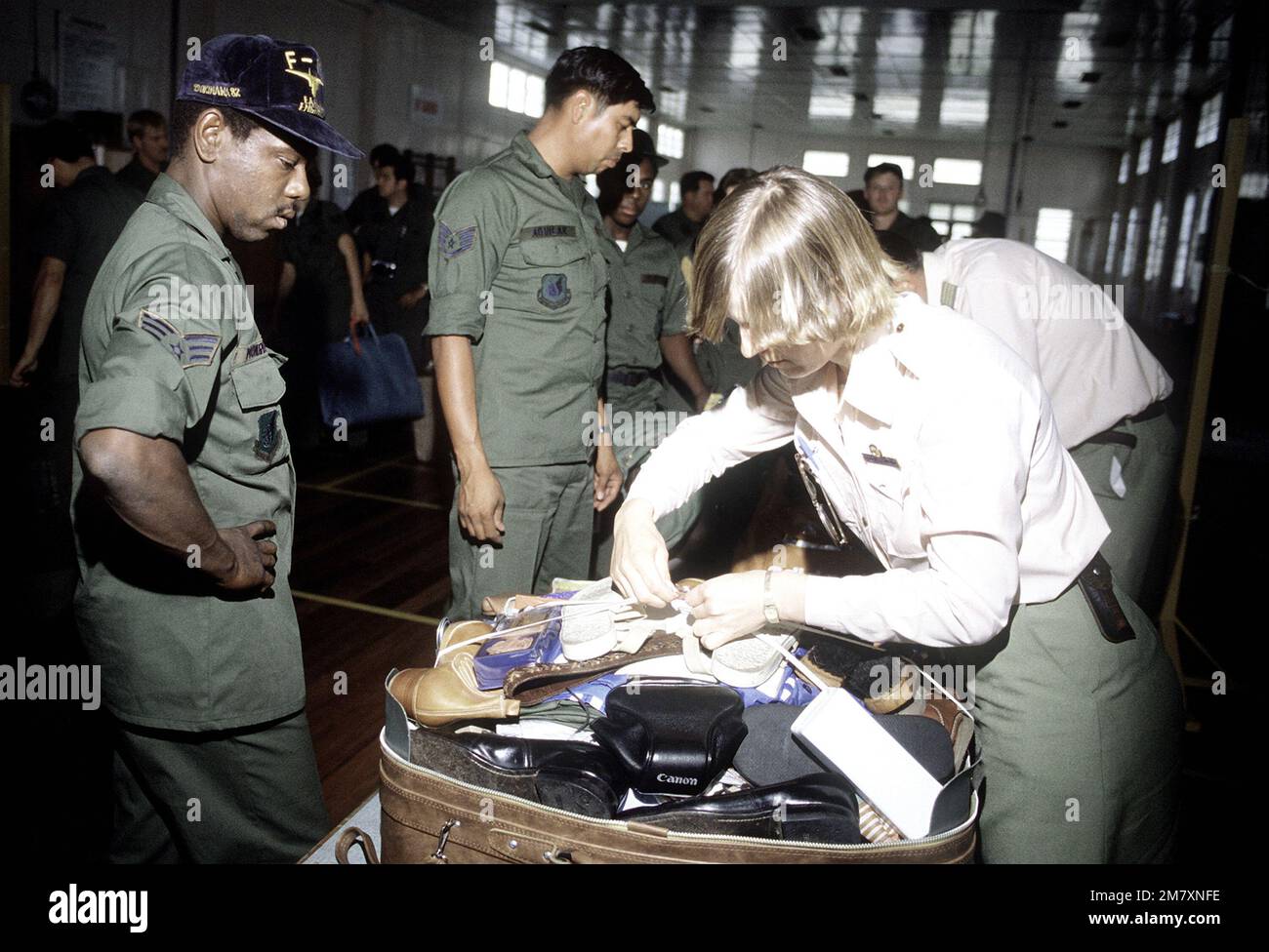 U.S. Air Force personnel go through customs upon their arrival for ...