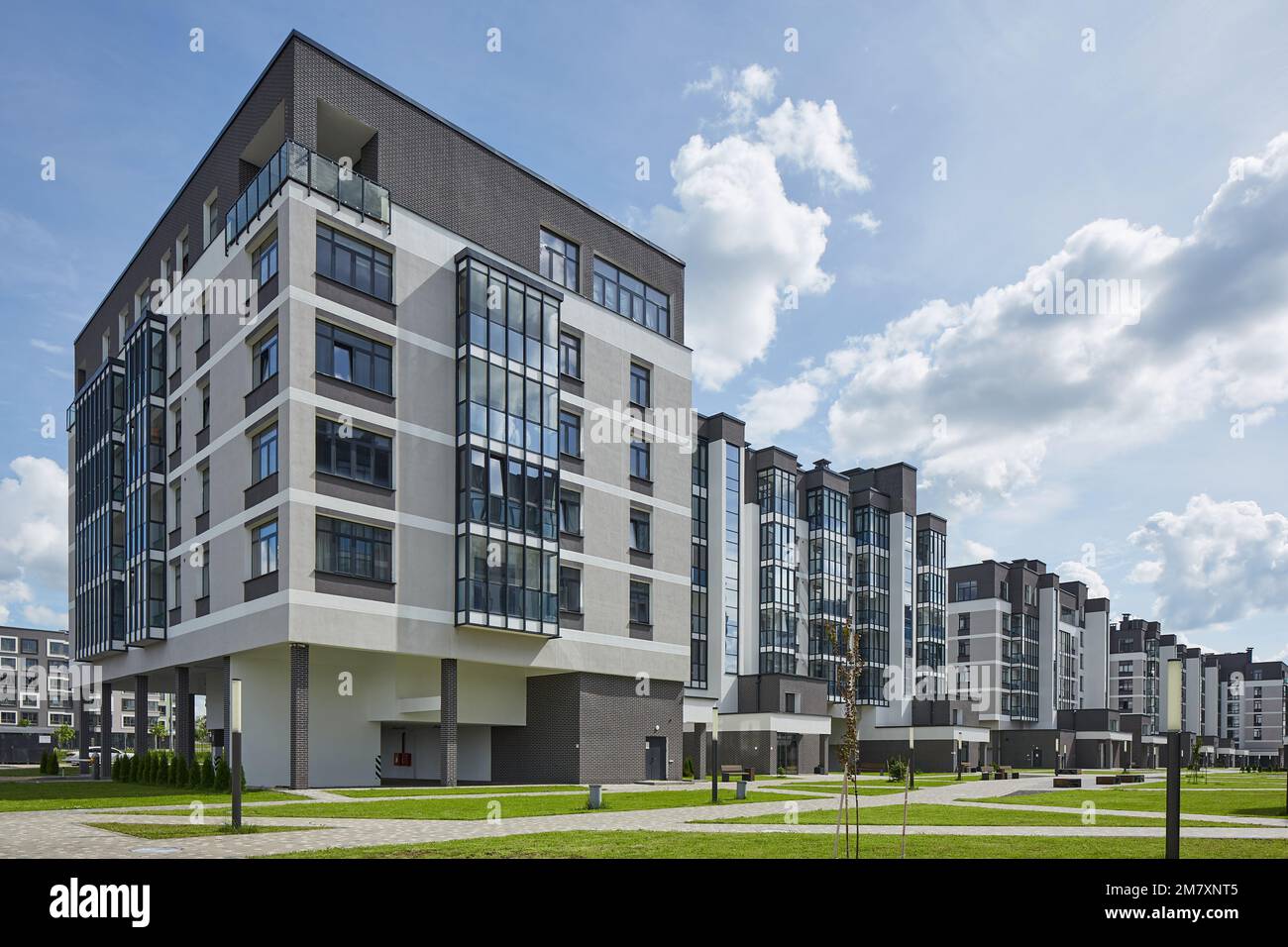 New modern block of flats in green area. residential apartment with ...
