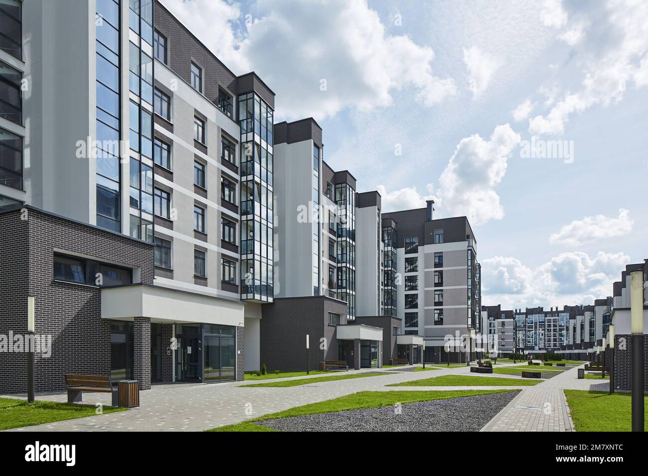 New modern block of flats in green area. residential apartment with ...