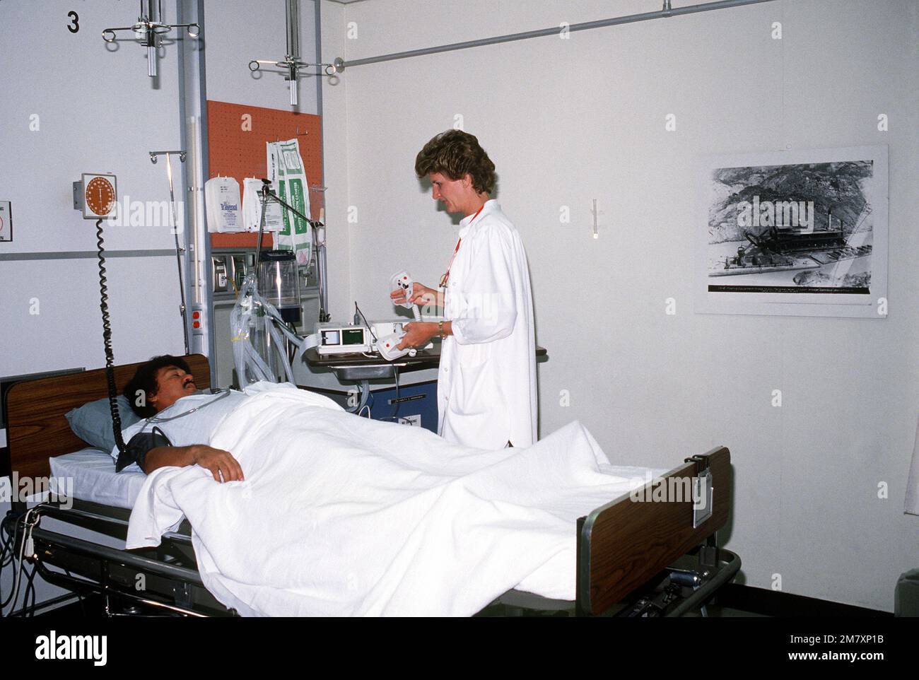 Bird Angermuller, a registered nurse, assists a critically ill patient ...
