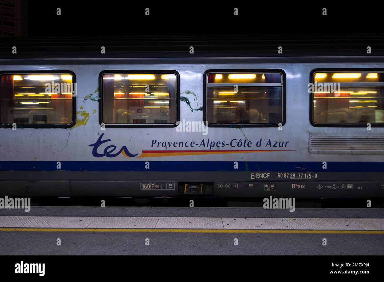 A TER (Train Express Regional) is on the platform in Toulon station ...