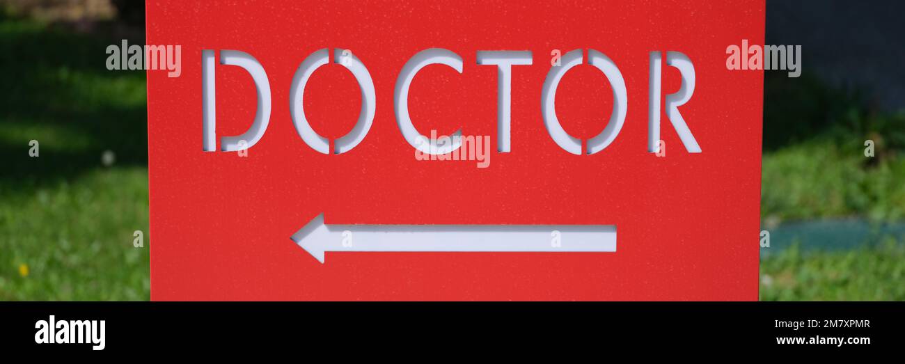 Red table with word doctor and arrow Stock Photo - Alamy