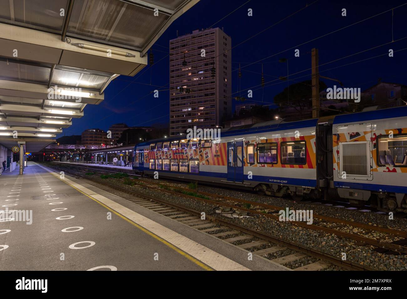 A TER (Train Express Regional) is on the platform in Toulon station ...