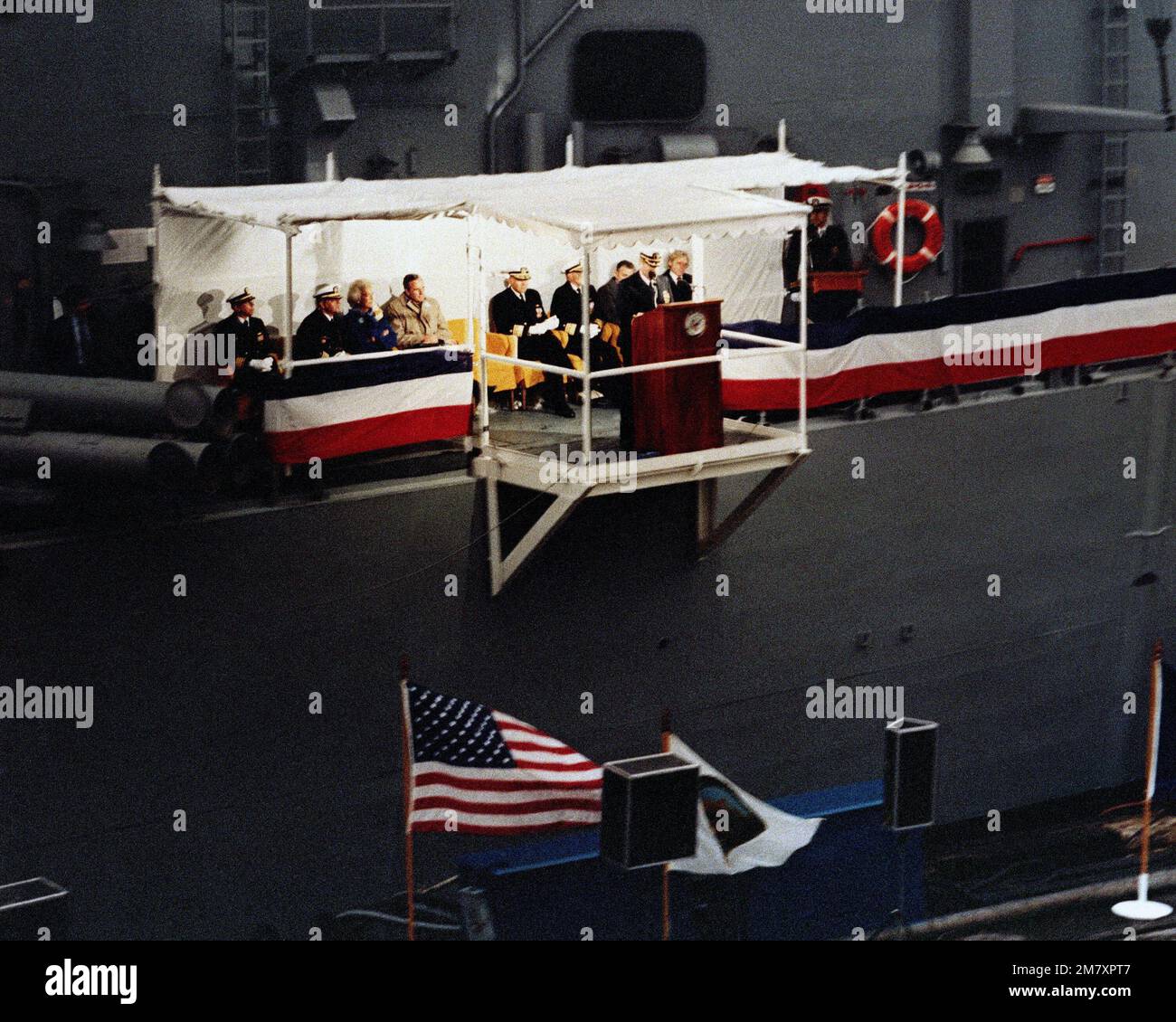 A guest speaks during the commissioning ceremony for the Oliver Hazard ...