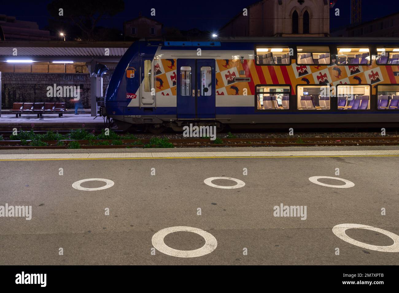 A TER (Train Express Regional) is on the platform in Toulon station ...