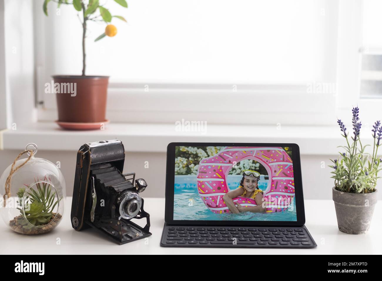 tablet, photo camera on an office desk Stock Photo - Alamy
