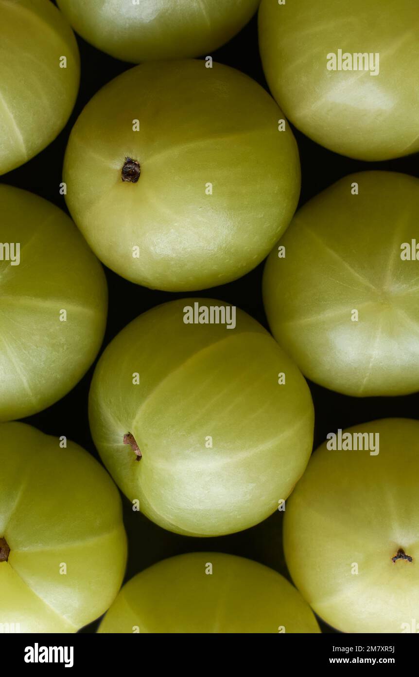 close-up view of fresh amla or indian gooseberry, pile of emblic high ...