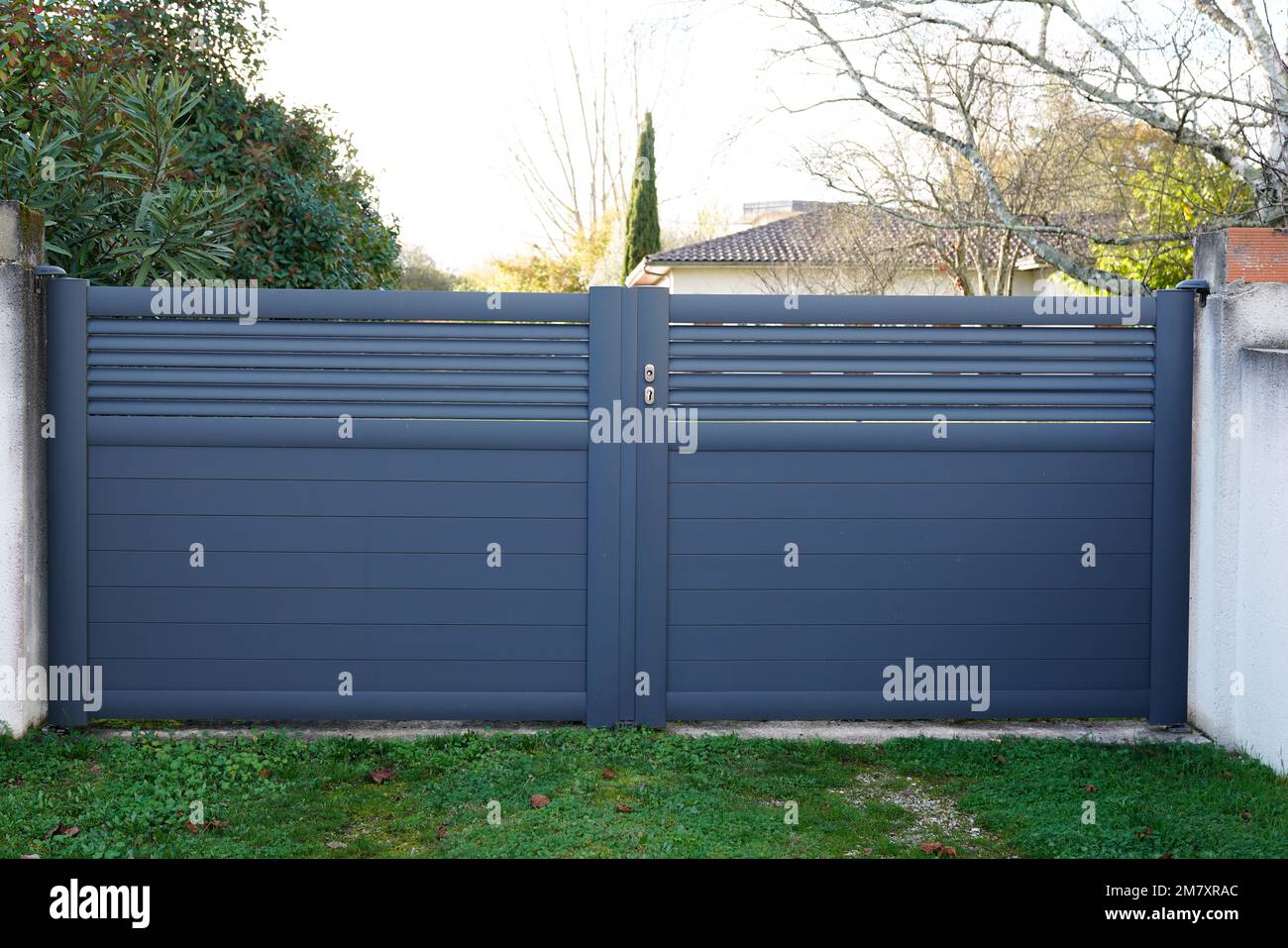 Aluminum steel grey metal gate house portal of suburb home Stock Photo ...