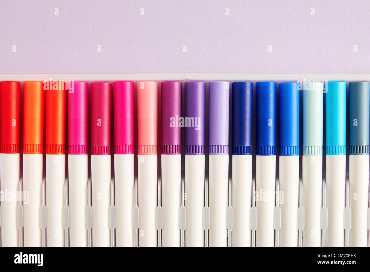 Set of watercolor markers for drawing and sketching on purple ...