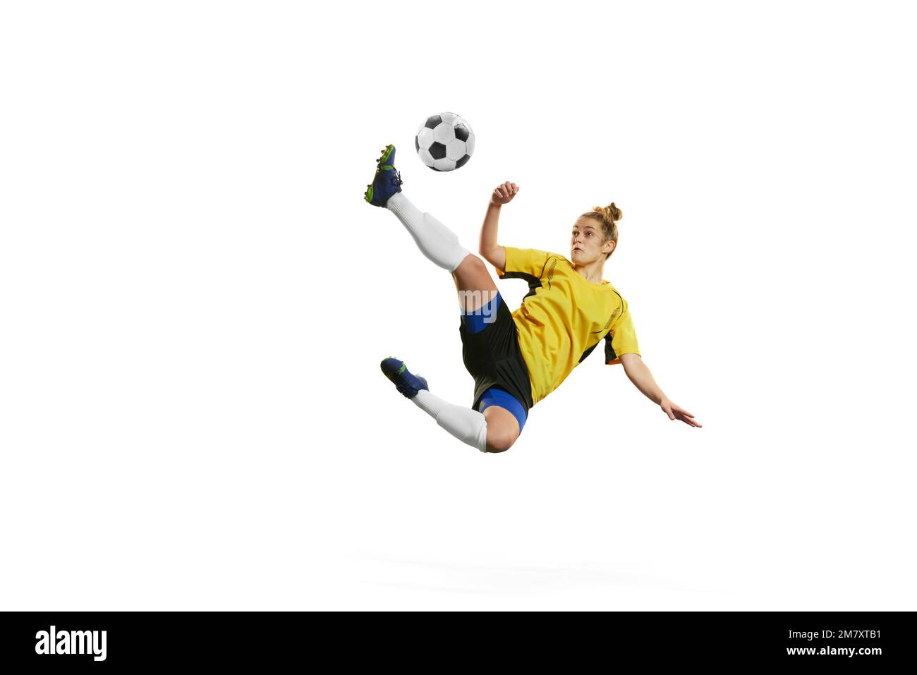Leg kick. Young professional female football, soccer player in motion ...