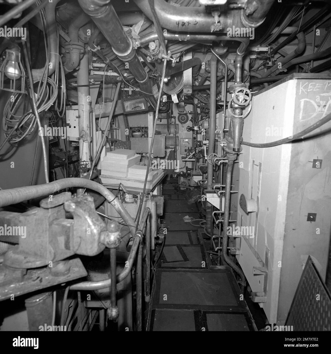 The lower level engine room aboard the guided missile frigate DOYLE ...