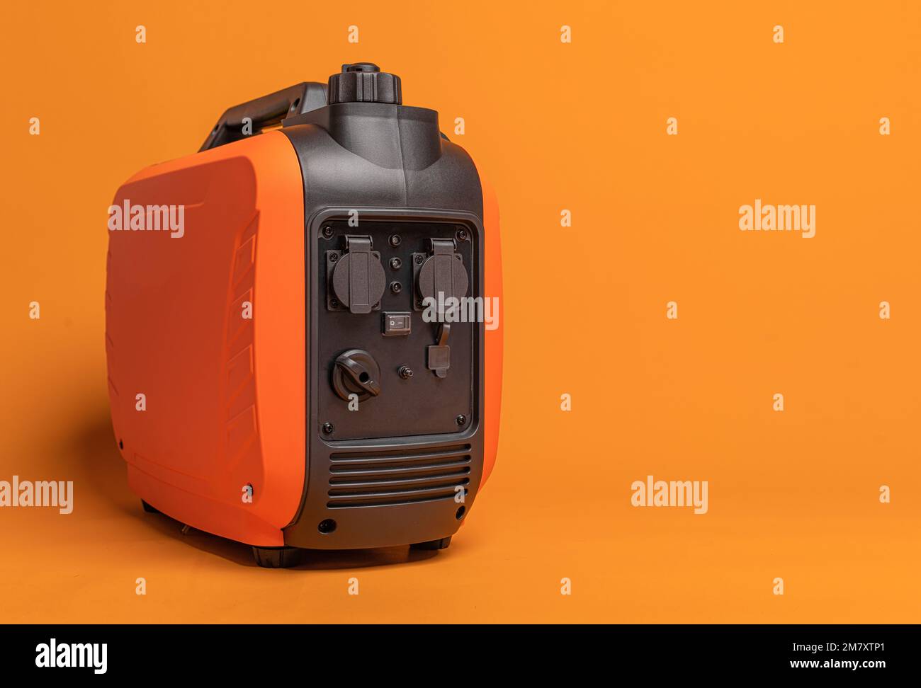 Inverter gasoline generator on an orange background Stock Photo - Alamy