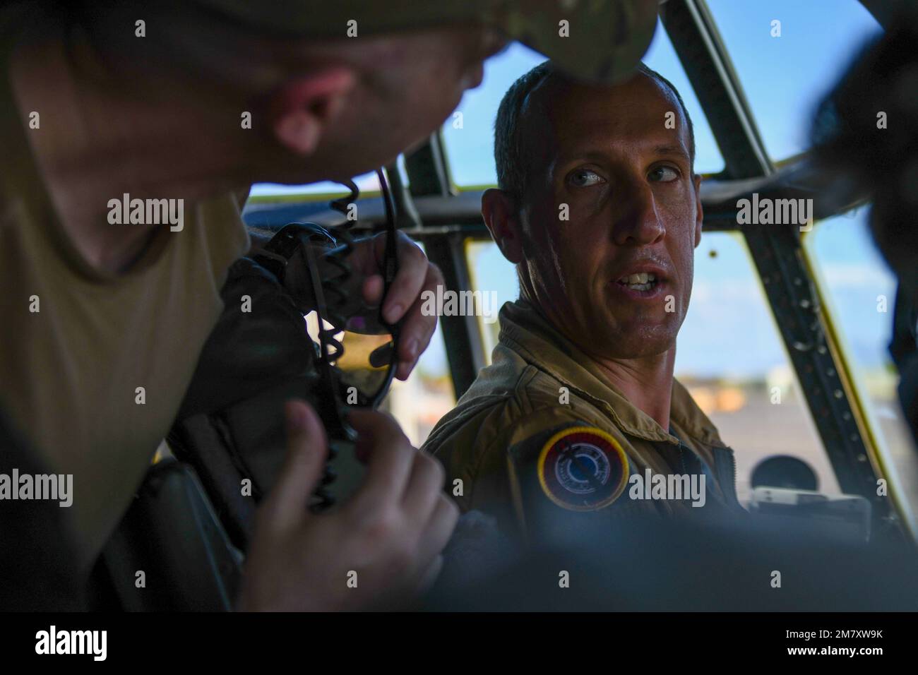 Maj. Nicholas Reeves, 36th Airlift Squadron C130-J Pilot, left, speaks ...